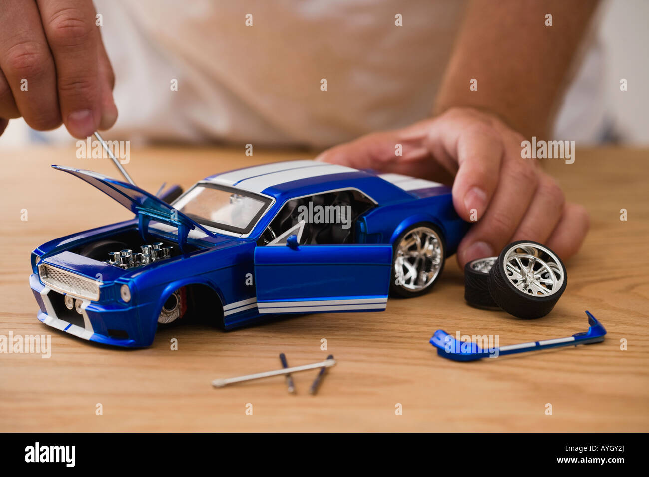 Man assembling model car Stock Photo - Alamy