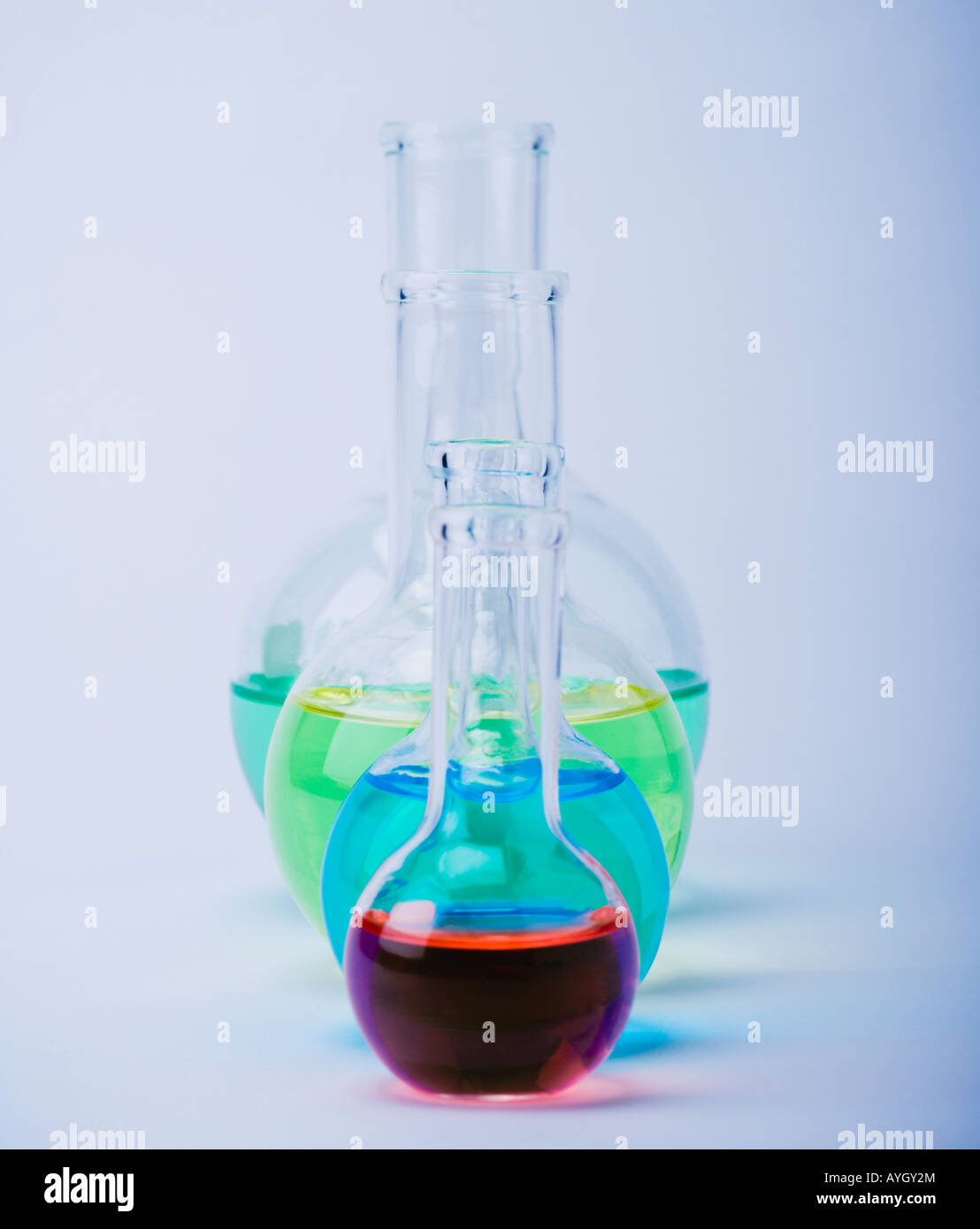 Row of beakers with liquid Stock Photo - Alamy