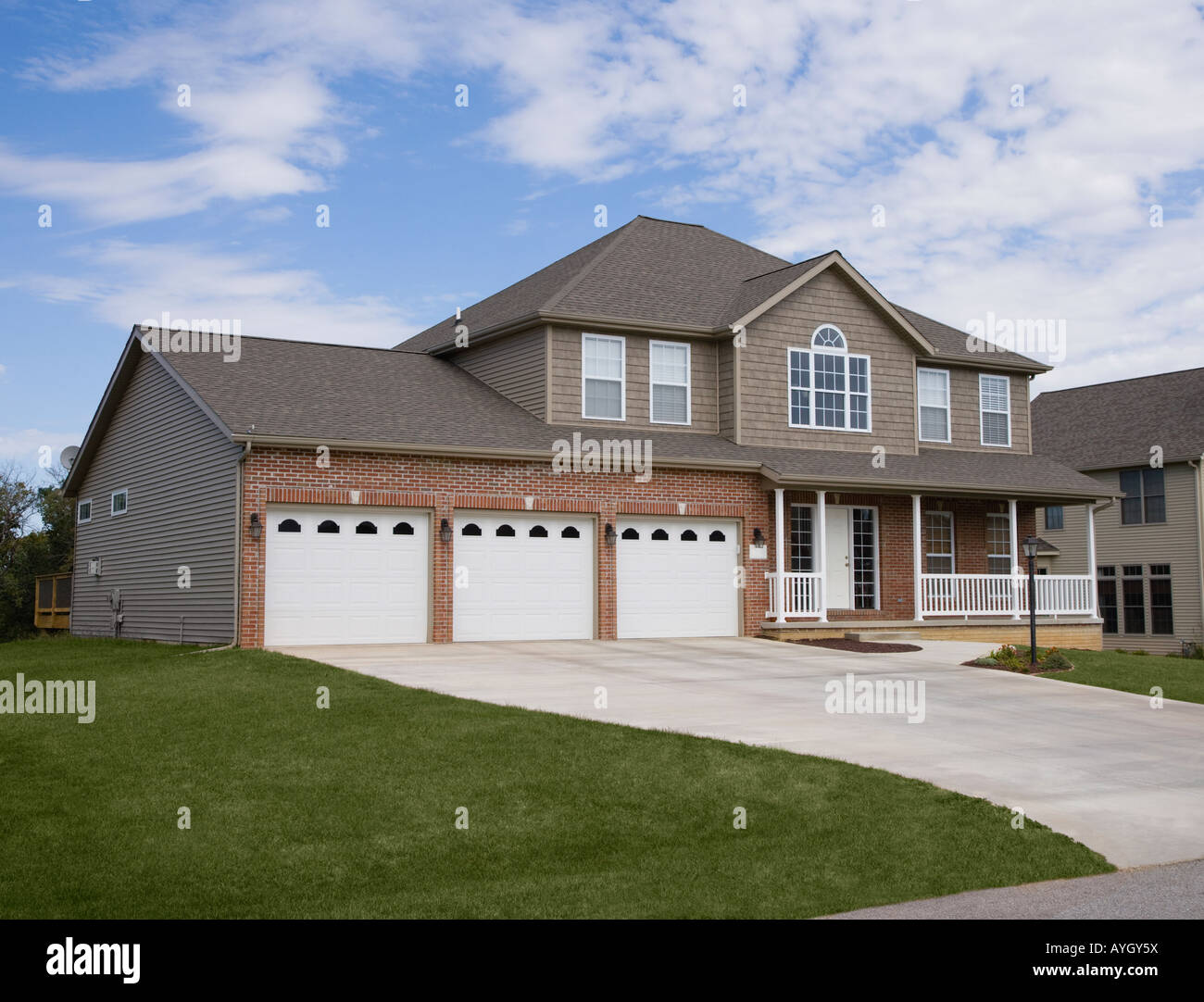 Front view of house with garage Stock Photo - Alamy