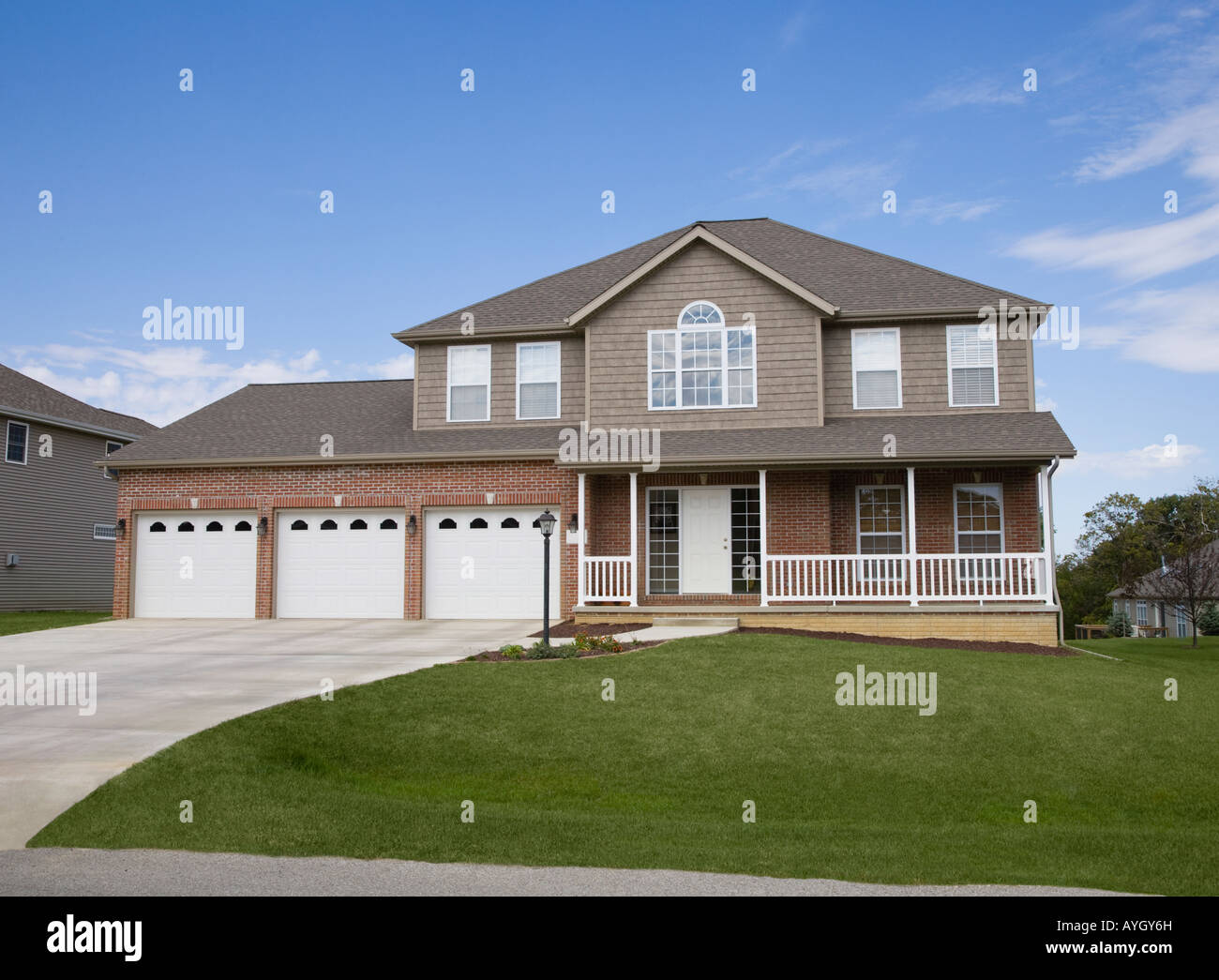 Front view of house with garage Stock Photo - Alamy