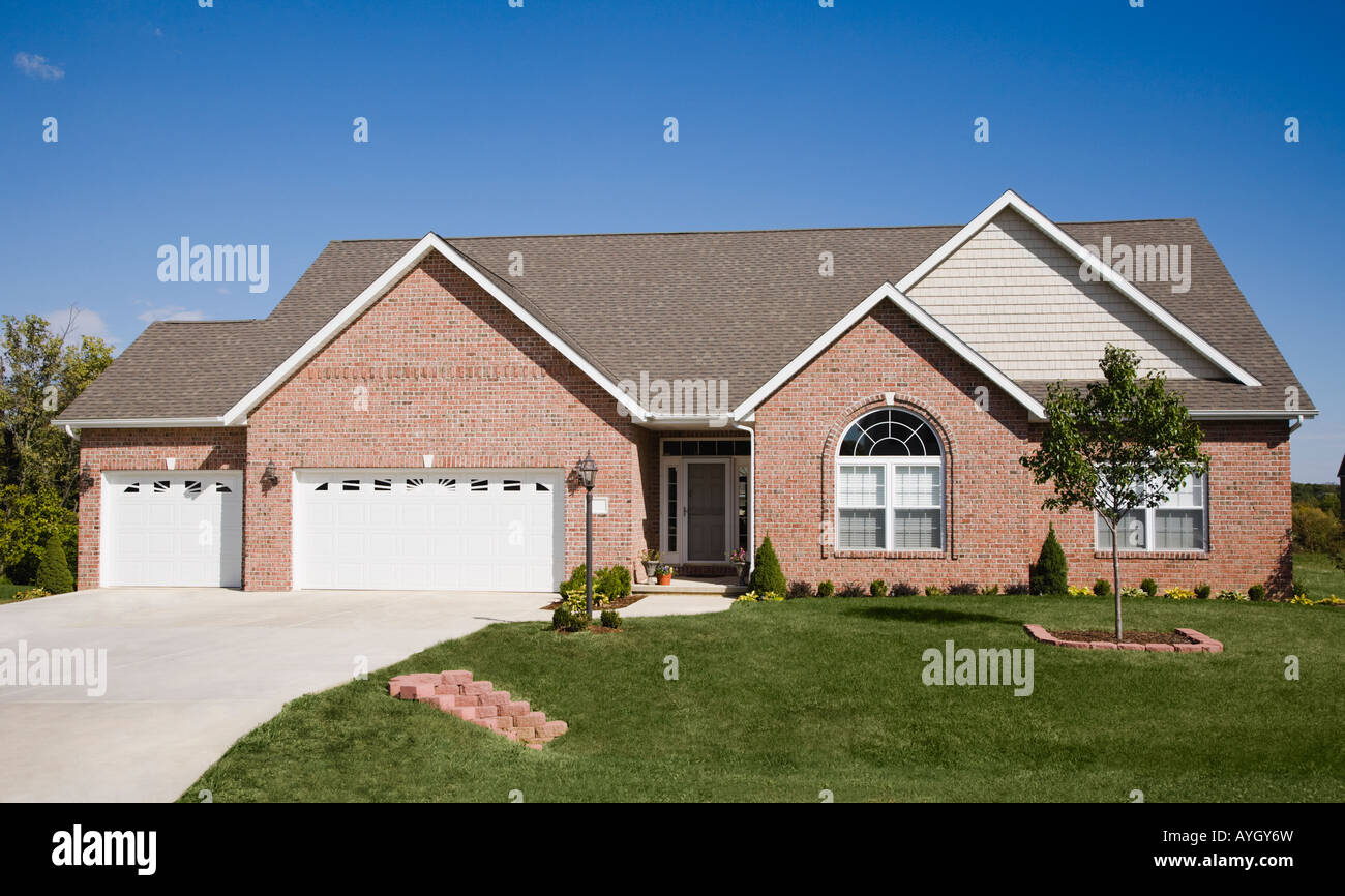Front view of house with garage Stock Photo - Alamy