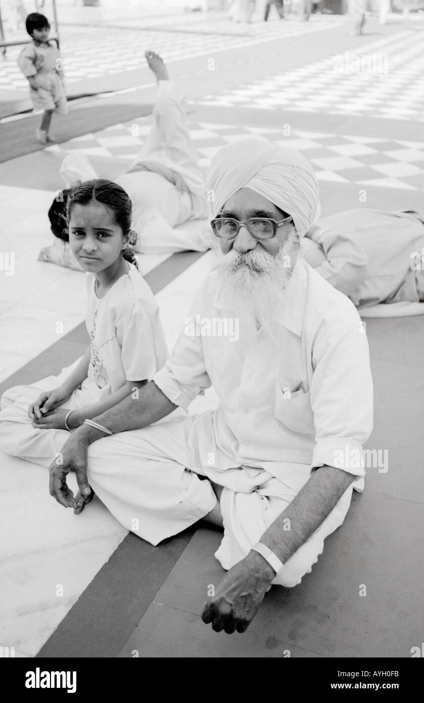 Sikh people in a Gurdwara in New Delhi in India in South Asia. Sikhism ...