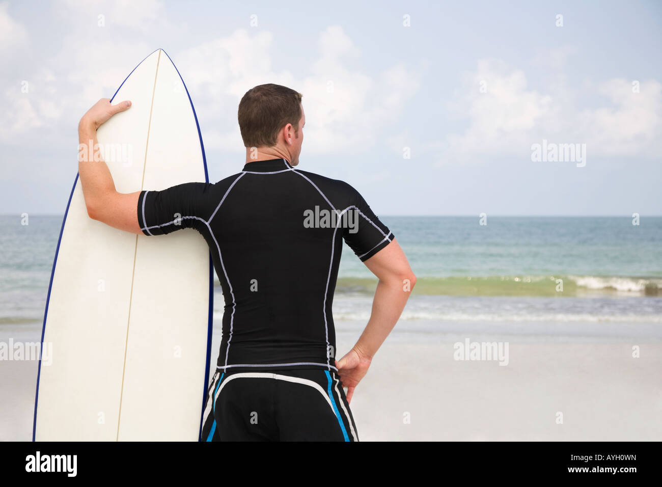 Man holding surfboard Stock Photo - Alamy