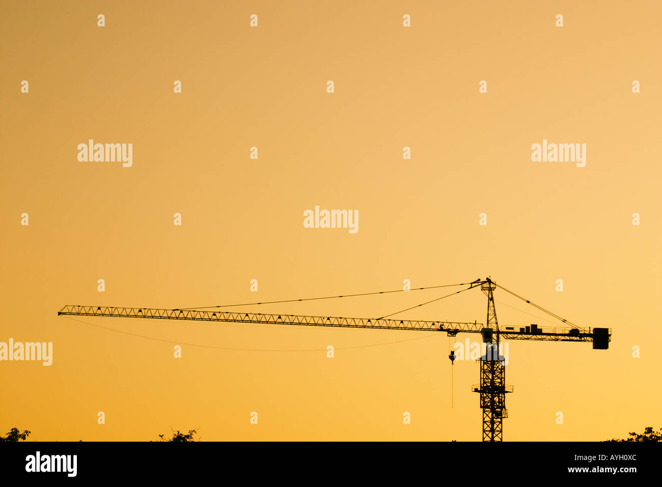 crane with yellow sky background Stock Photo - Alamy