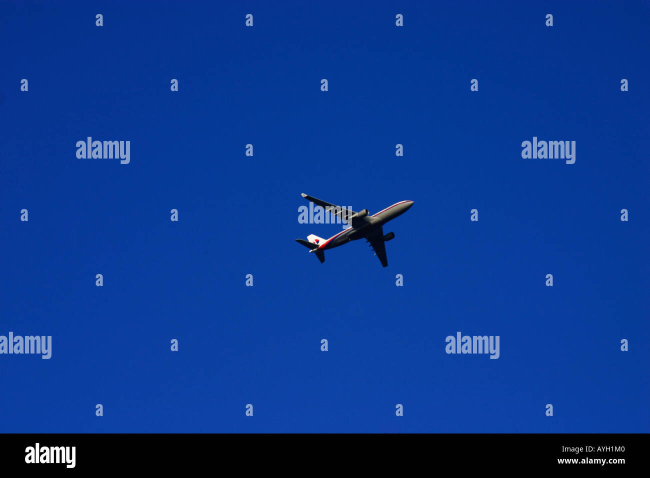 Malaysian airlines aeroplane in mid air Stock Photo - Alamy
