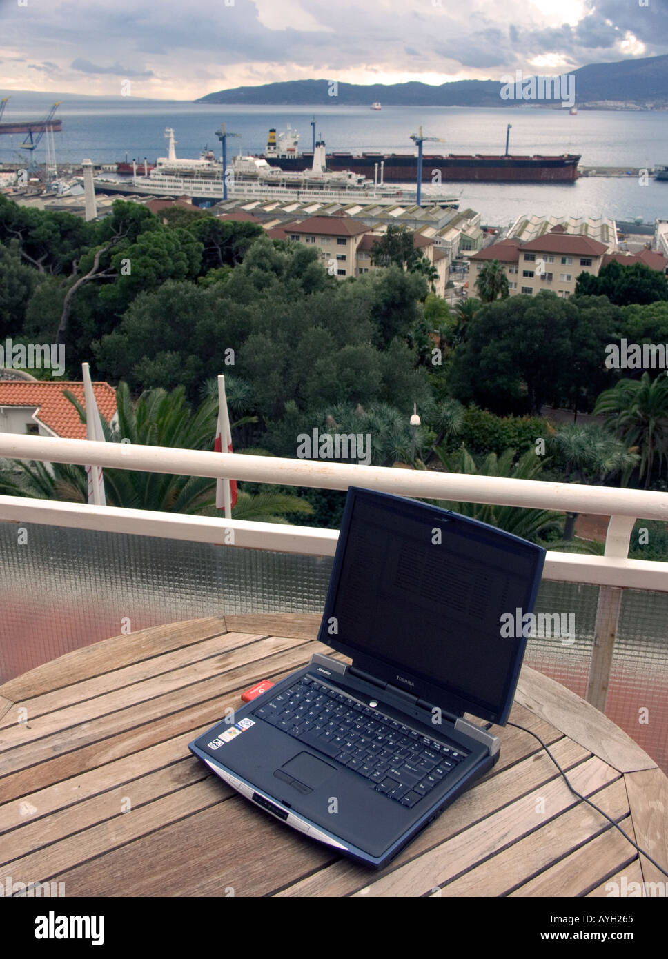 Laptop Computer on Hotel Balcony with the Bay of Gibraltar and ships in ...