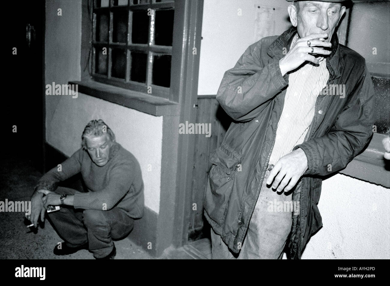 Two men smoking outside a pub in Ireland soon after the introduction of ...