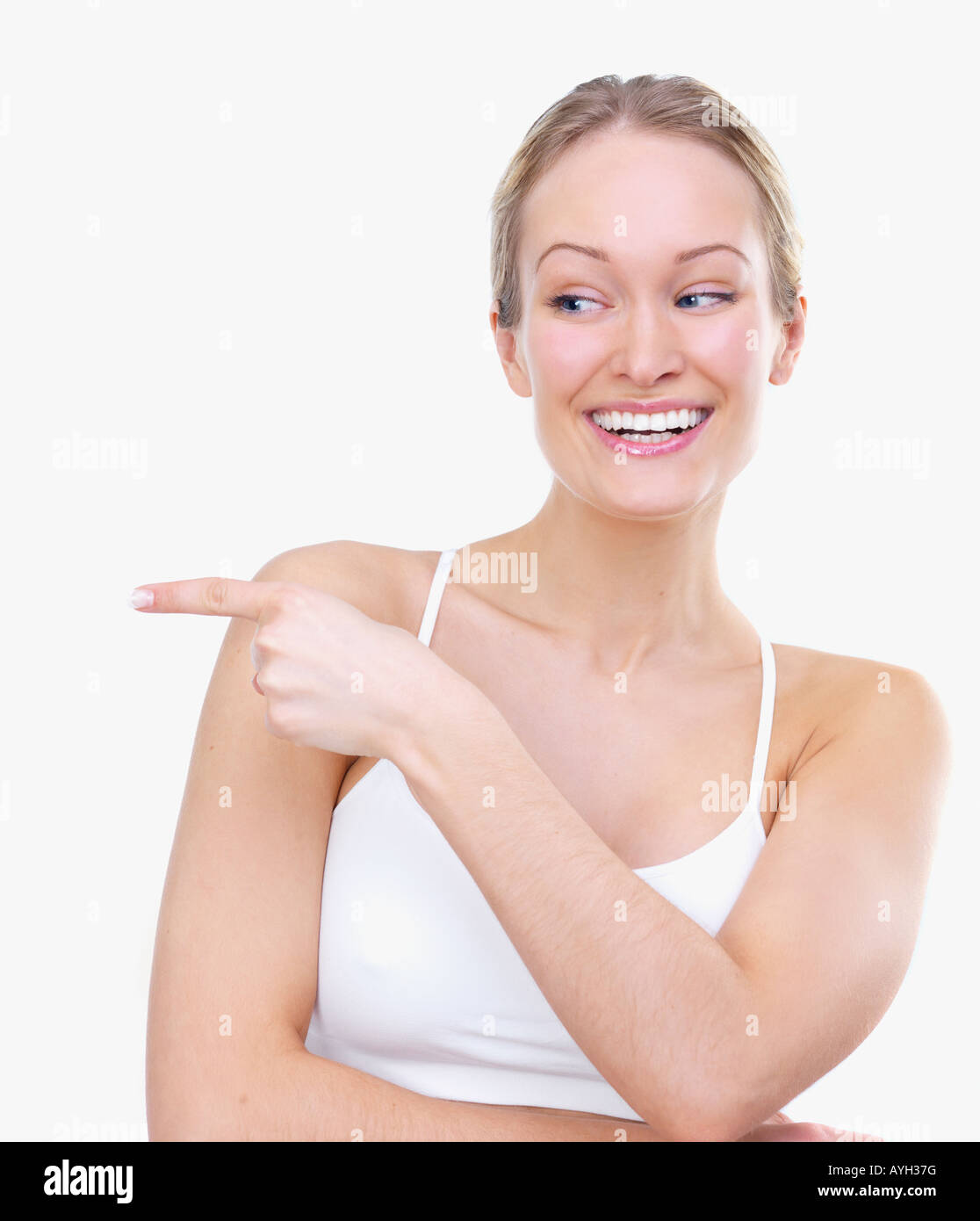 Woman pointing to side Stock Photo - Alamy