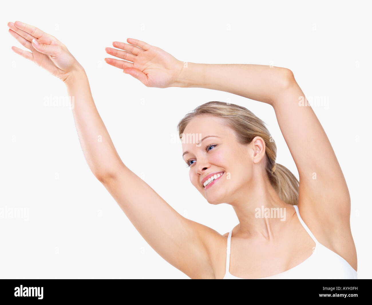 Woman with hand raised over head Stock Photo - Alamy