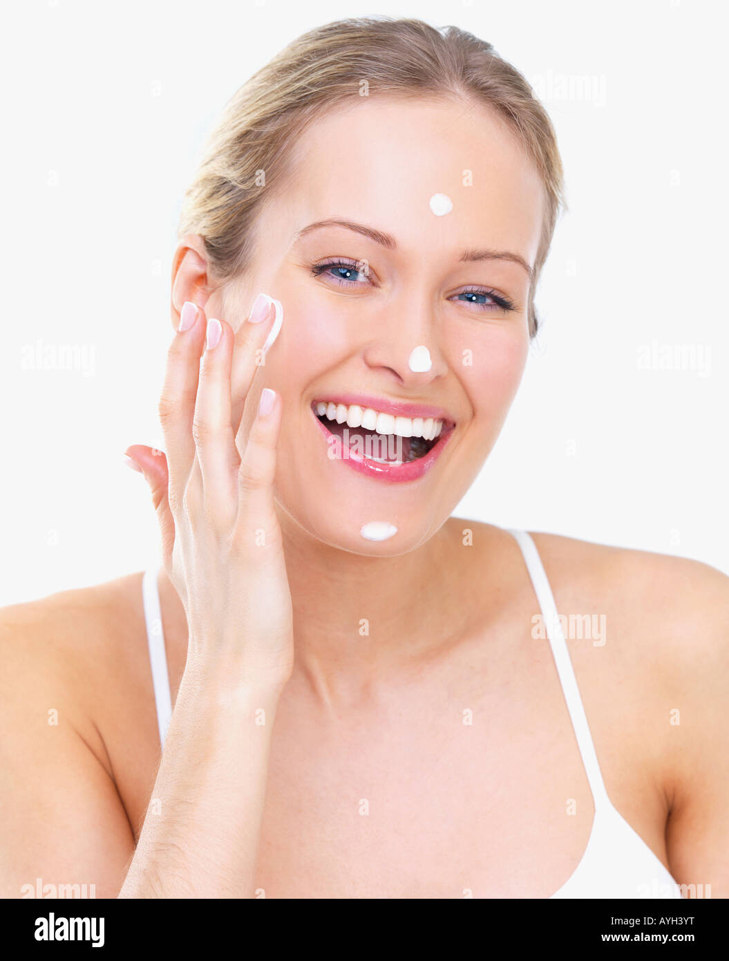 Woman rubbing cream face hi-res stock photography and images - Alamy