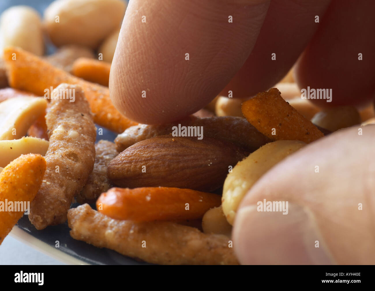Grabbing some Cajun Snack Mix Stock Photo - Alamy