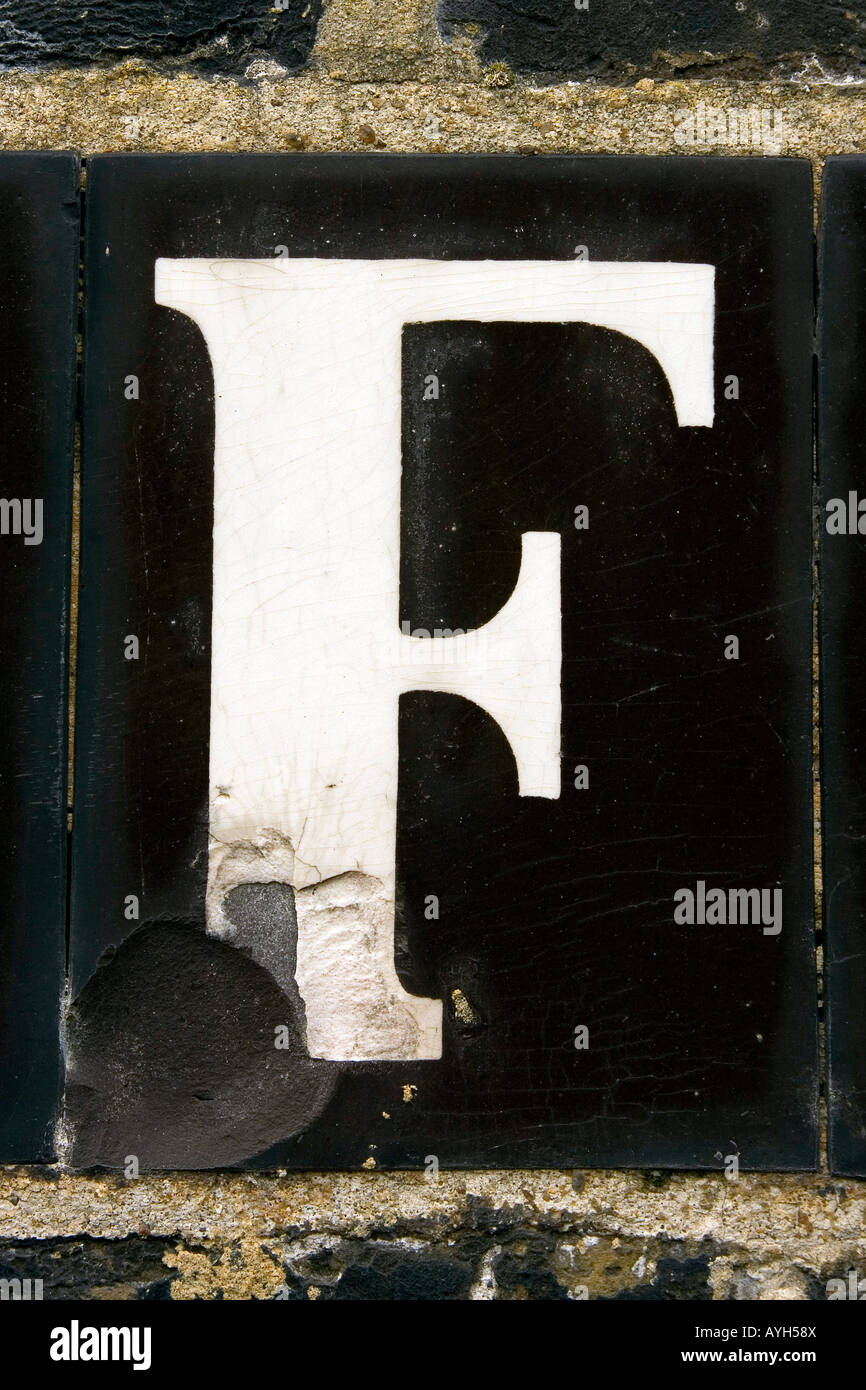 A broken and damaged letter F from street sign London England UK Stock ...