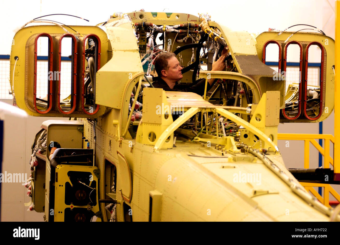 Skilled fitter working at the Westland Helicopter Factory Yeovil ...
