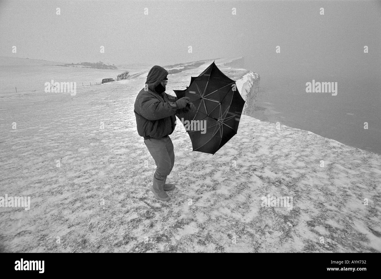 Battling with brolly hi-res stock photography and images - Alamy