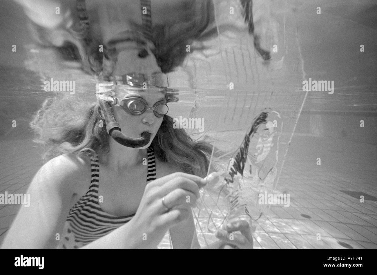 Girl holding breath underwater hi-res stock photography and images - Alamy