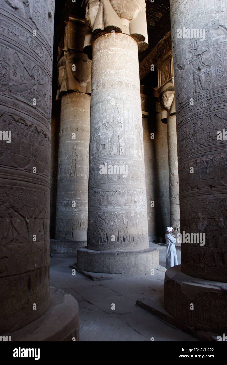 Edfu temple interior of one of the great halls and man in traditional ...