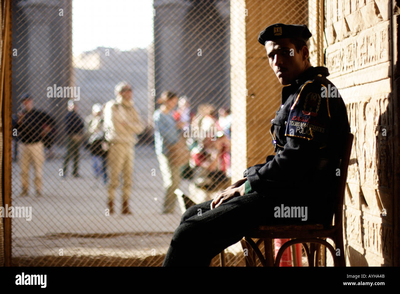 tourist police unit watching the entrance at the hall of the Edfu ...