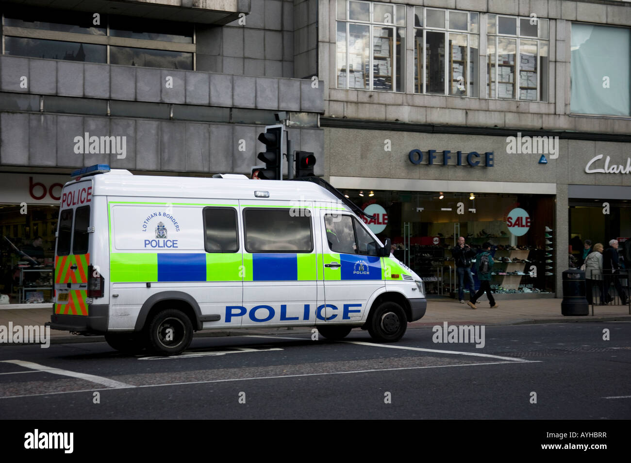 Police van, moving through traffic lights, Princes Street, Edinburgh ...