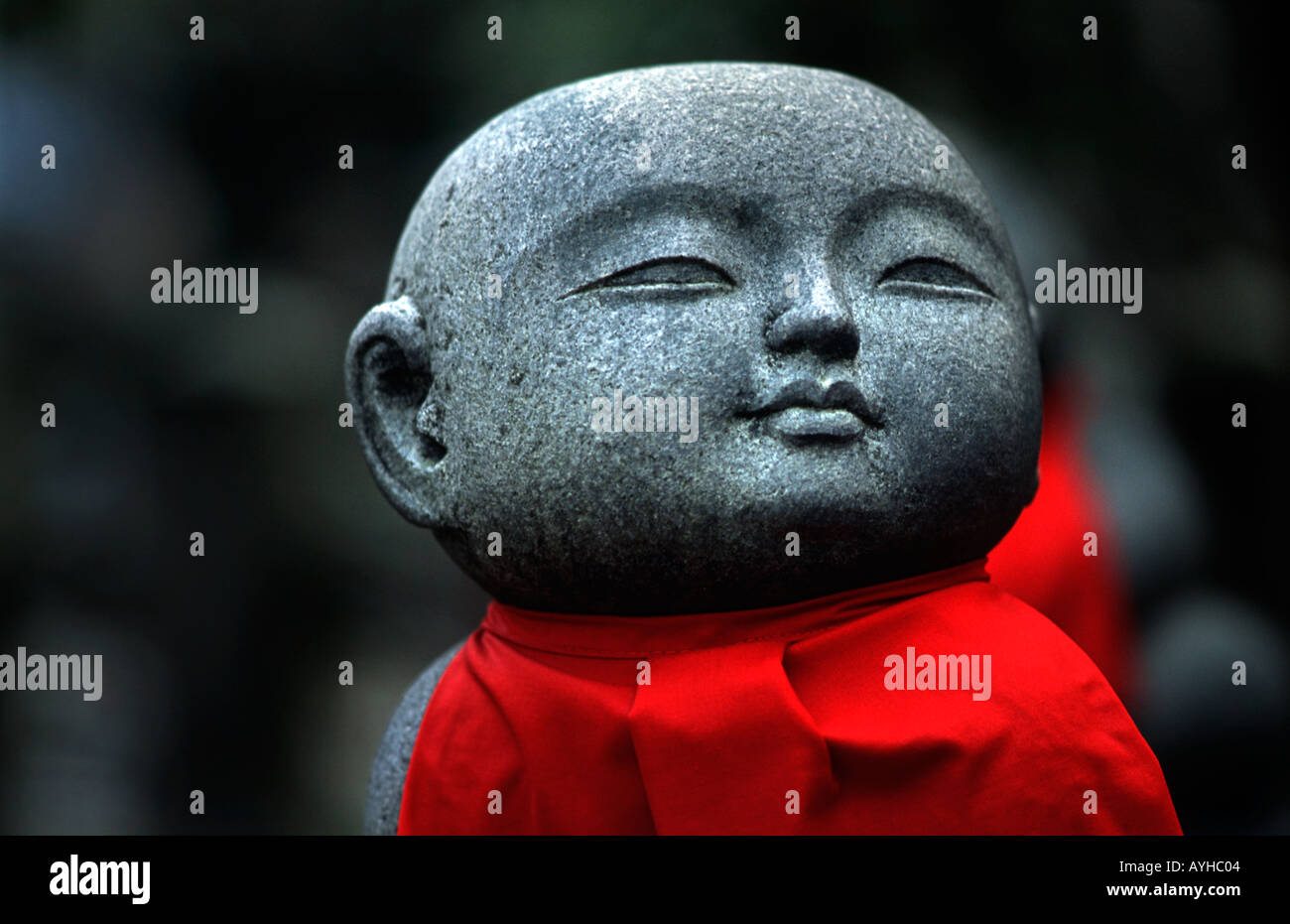 Mizo jizo sculpture with red fabric bib Yakoshido Shrine dedicated to ...