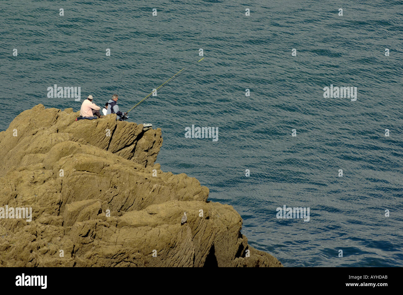 Pointe Du Groin Men Fishing At The Top Of The Cliff Stock Photo - Alamy