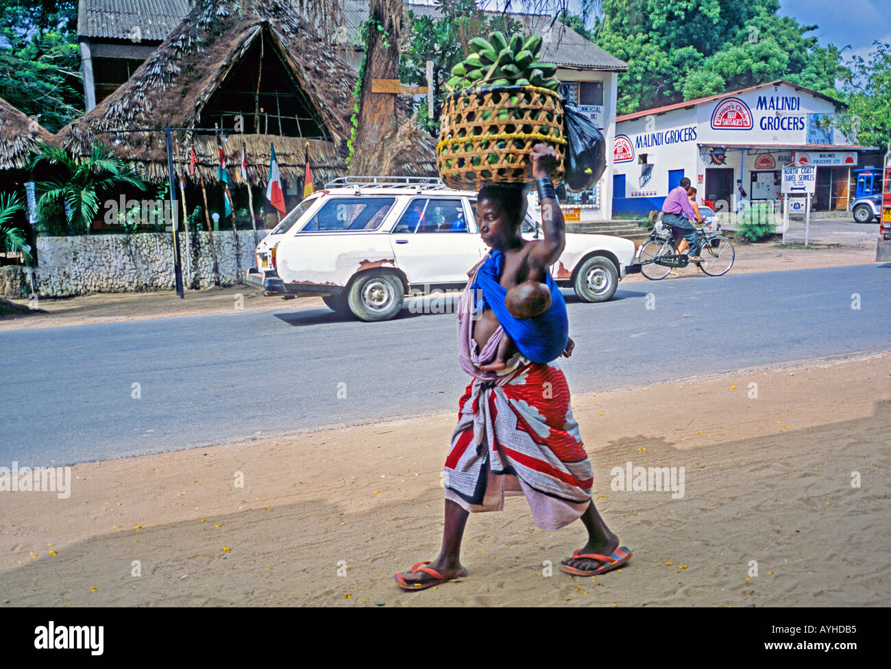 AFRICA KENYA MALINDI Kenyan woman dressed in traditional kanga cloth ...