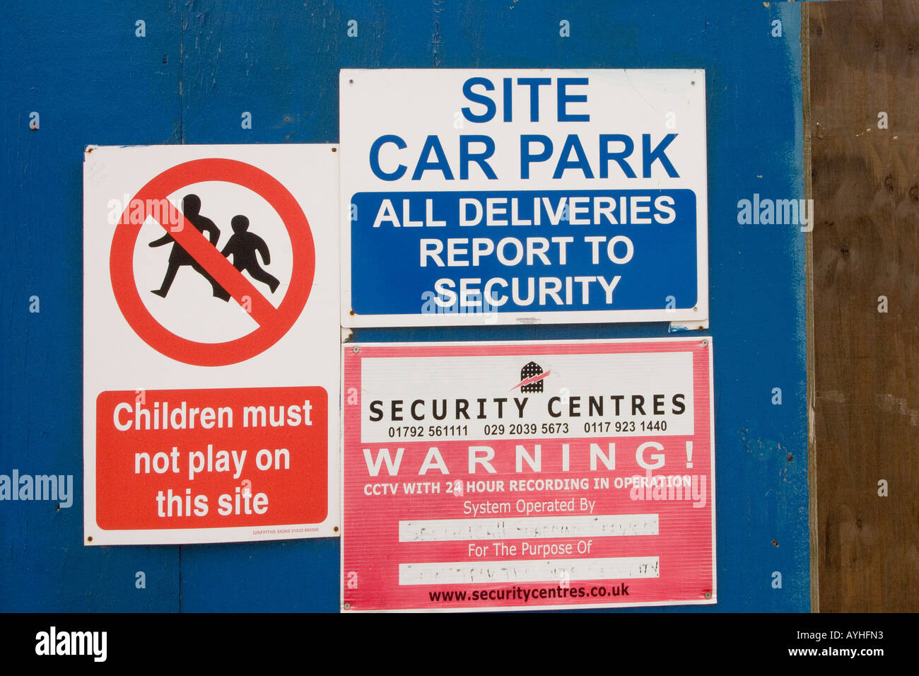 Security warning signs outside a construction site Cardiff Bay UK Stock ...