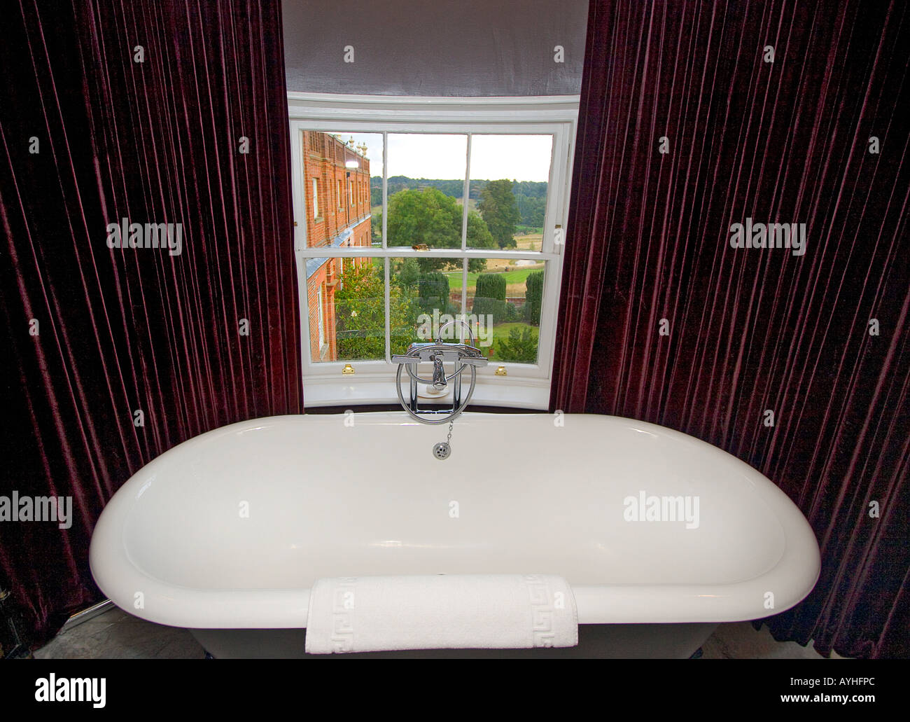 Old fashioned tub and pastoral view out window The Grove estate resort ...