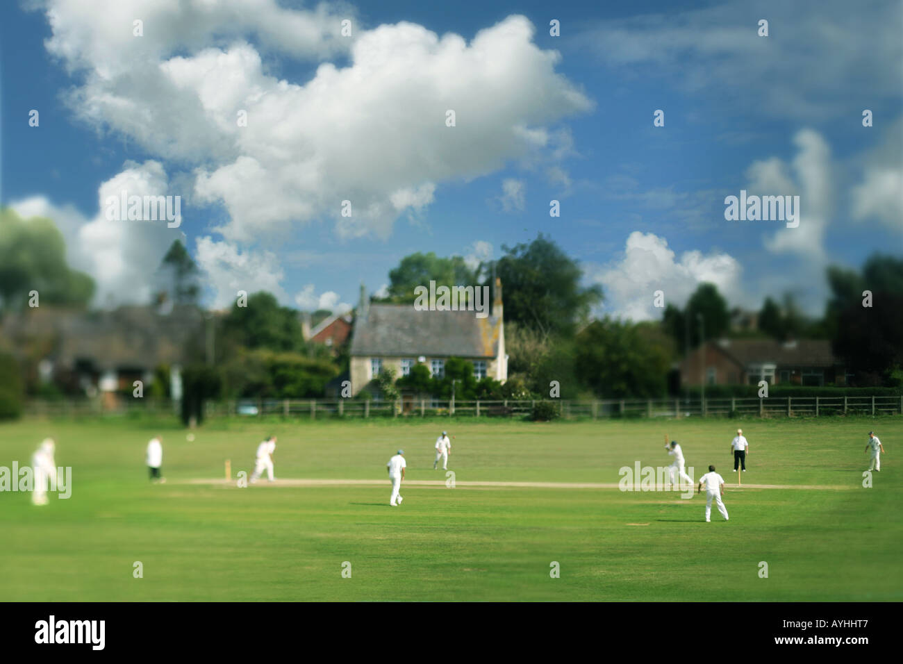 cricket game on a village green Stock Photo - Alamy