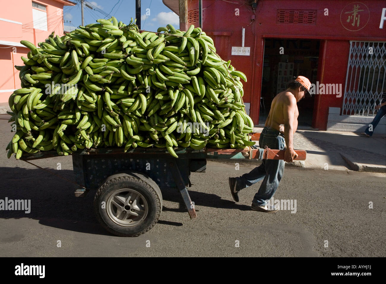 Man hauling plantains in wheeled cart Jinotepe Nicaragua Stock Photo ...