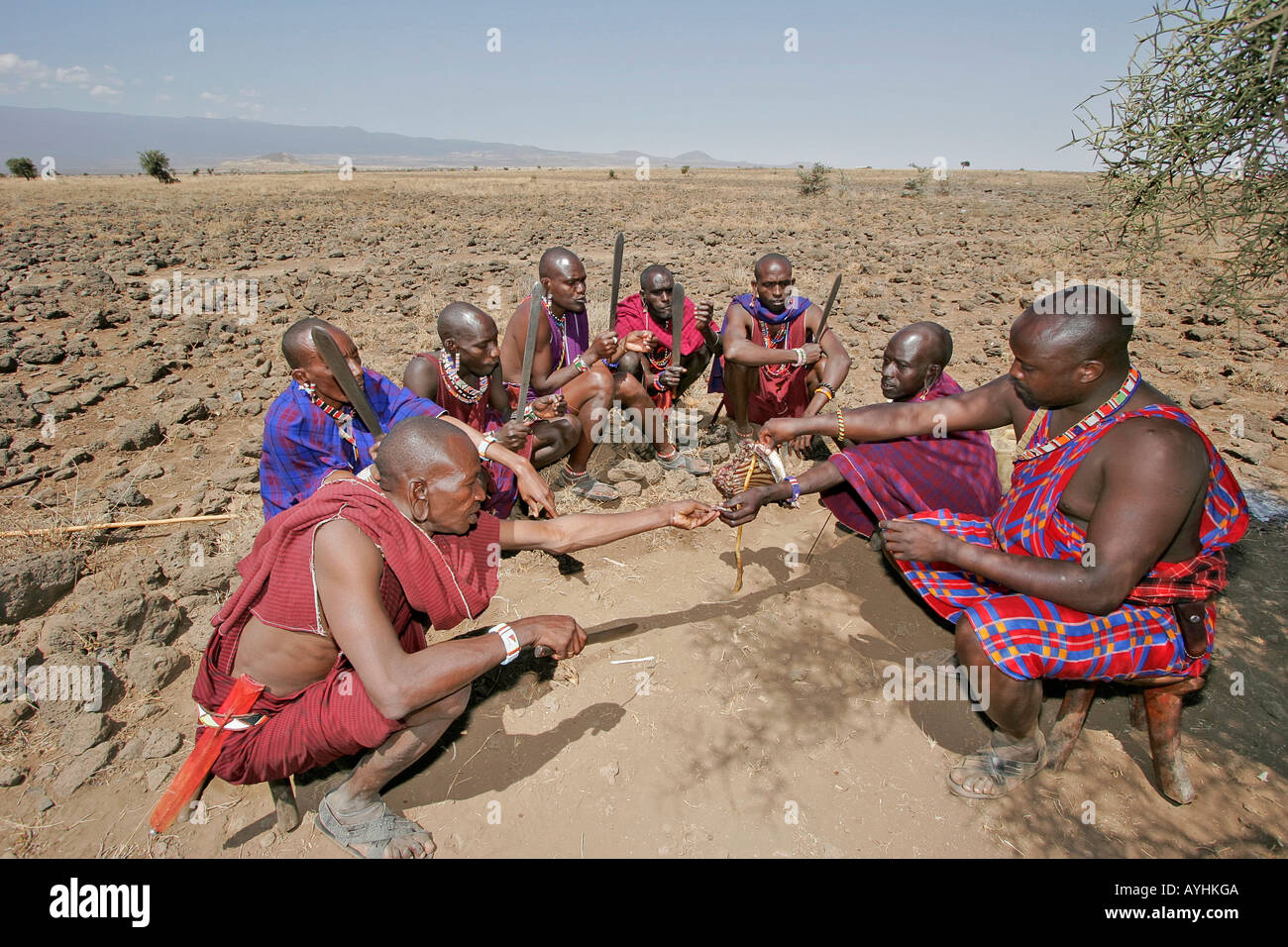 Maasai men eating goat meat hi-res stock photography and images - Alamy