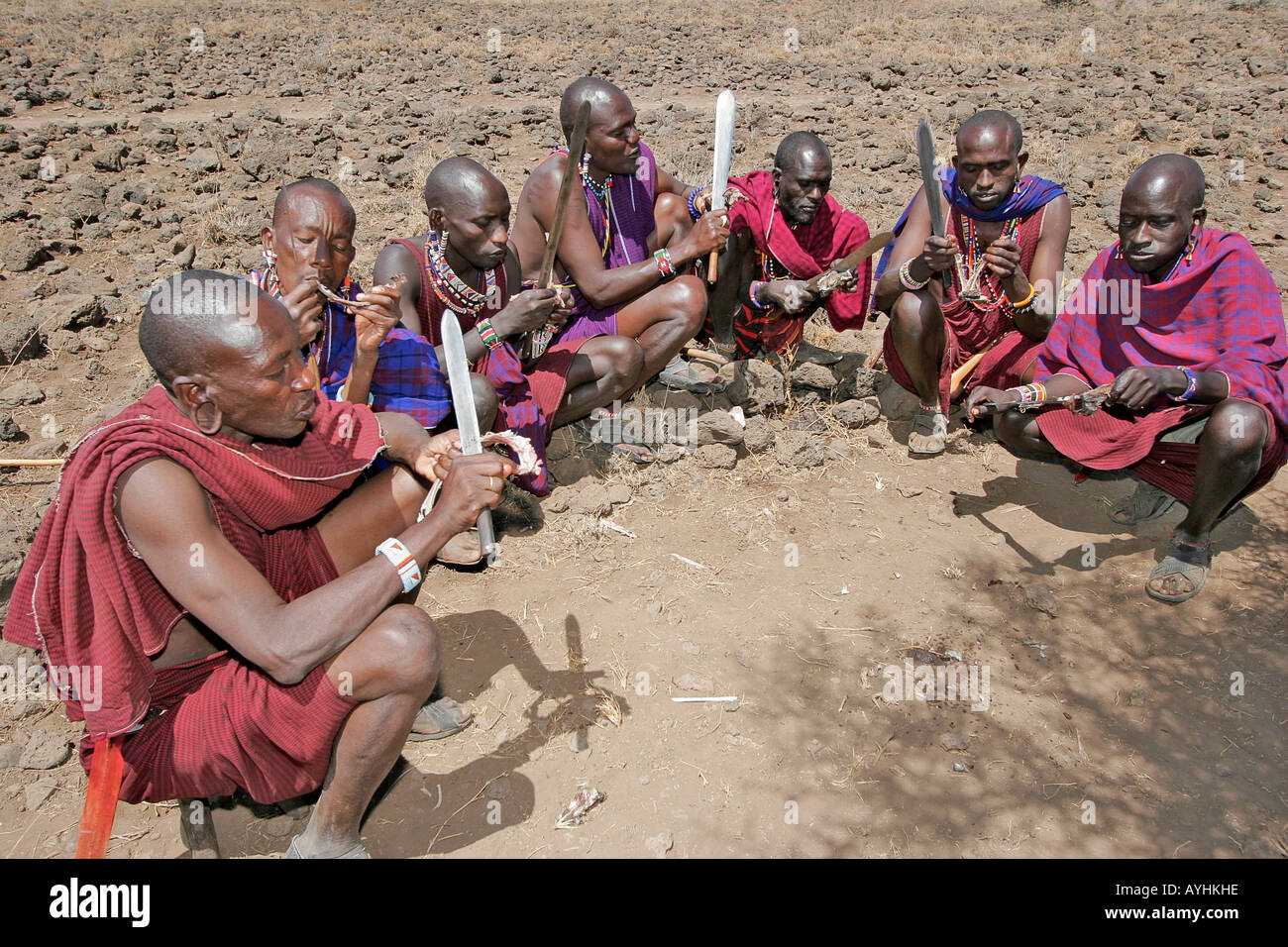 Maasai men eating goat meat hi-res stock photography and images - Alamy