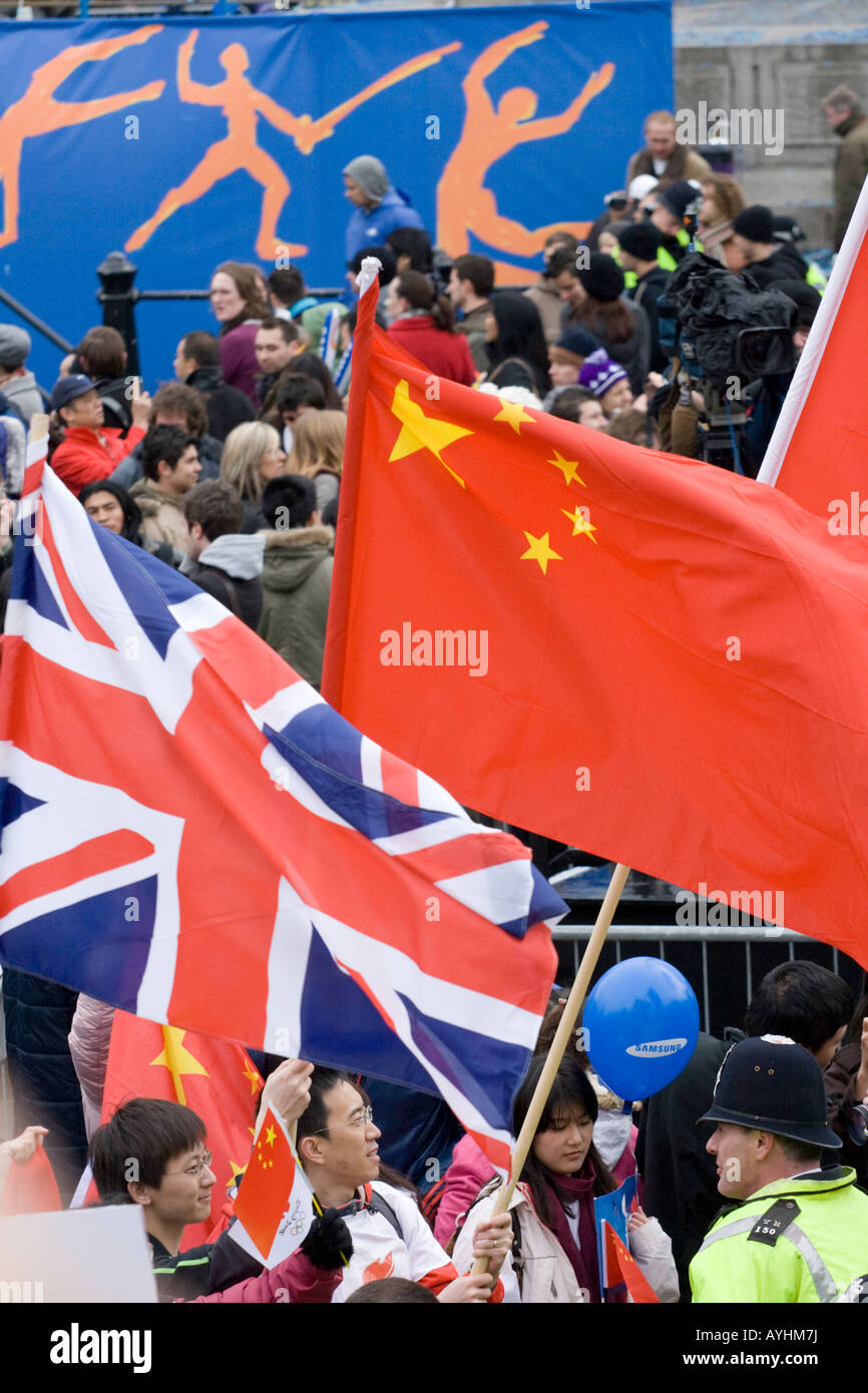 A Chinese flag is flown next to the Union Jack in Trafalgar Square ...