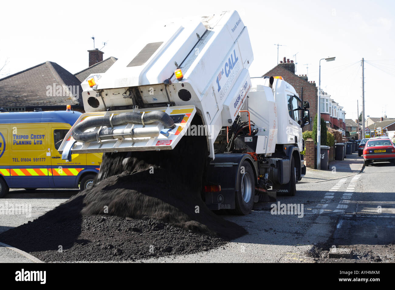 Road sweeper truck tipping its waste Stock Photo - Alamy
