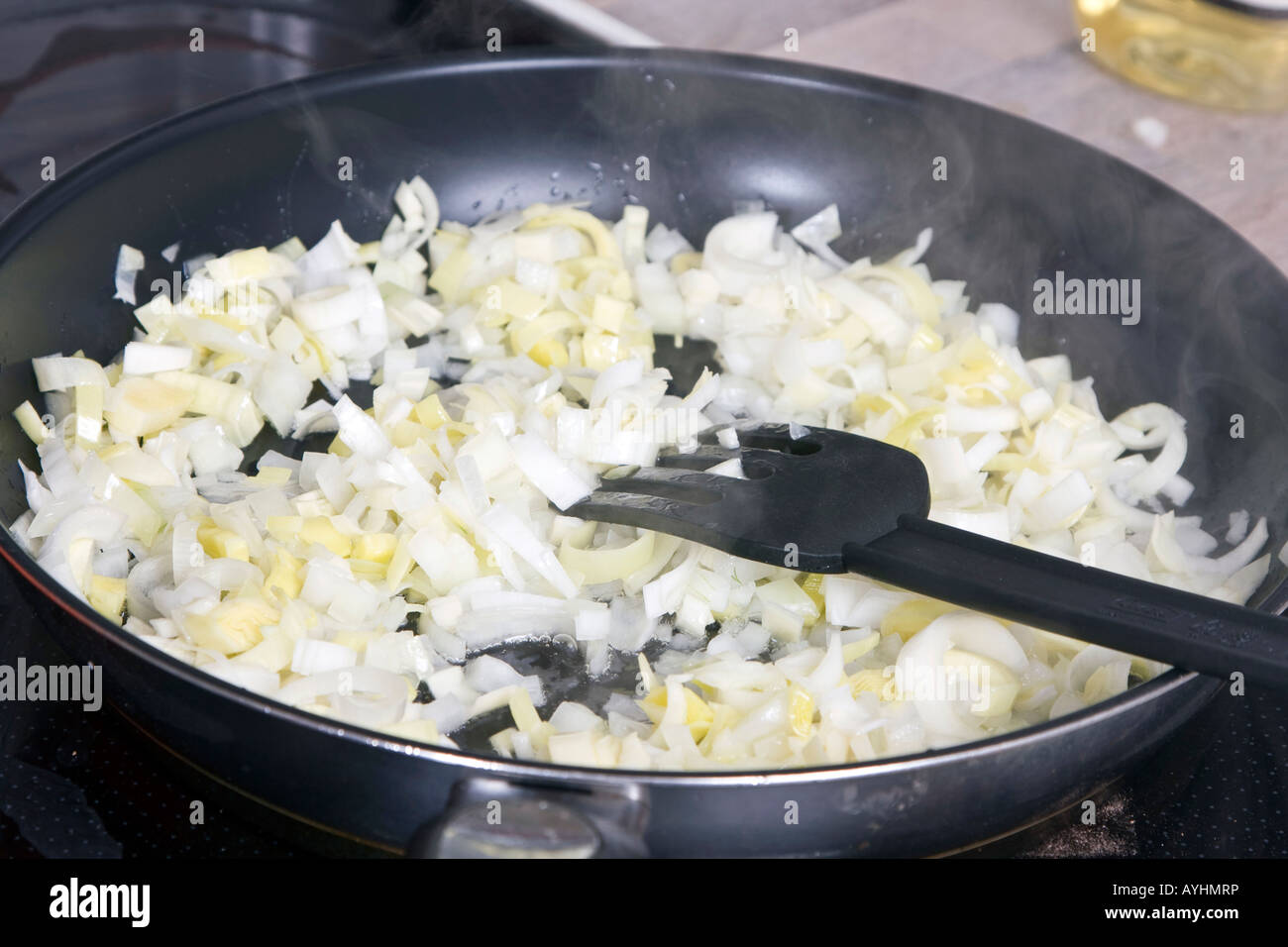 Chopped onion in a frying pan Stock Photo - Alamy