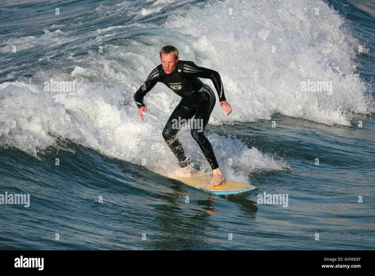 A Surfer riding a wave Stock Photo - Alamy