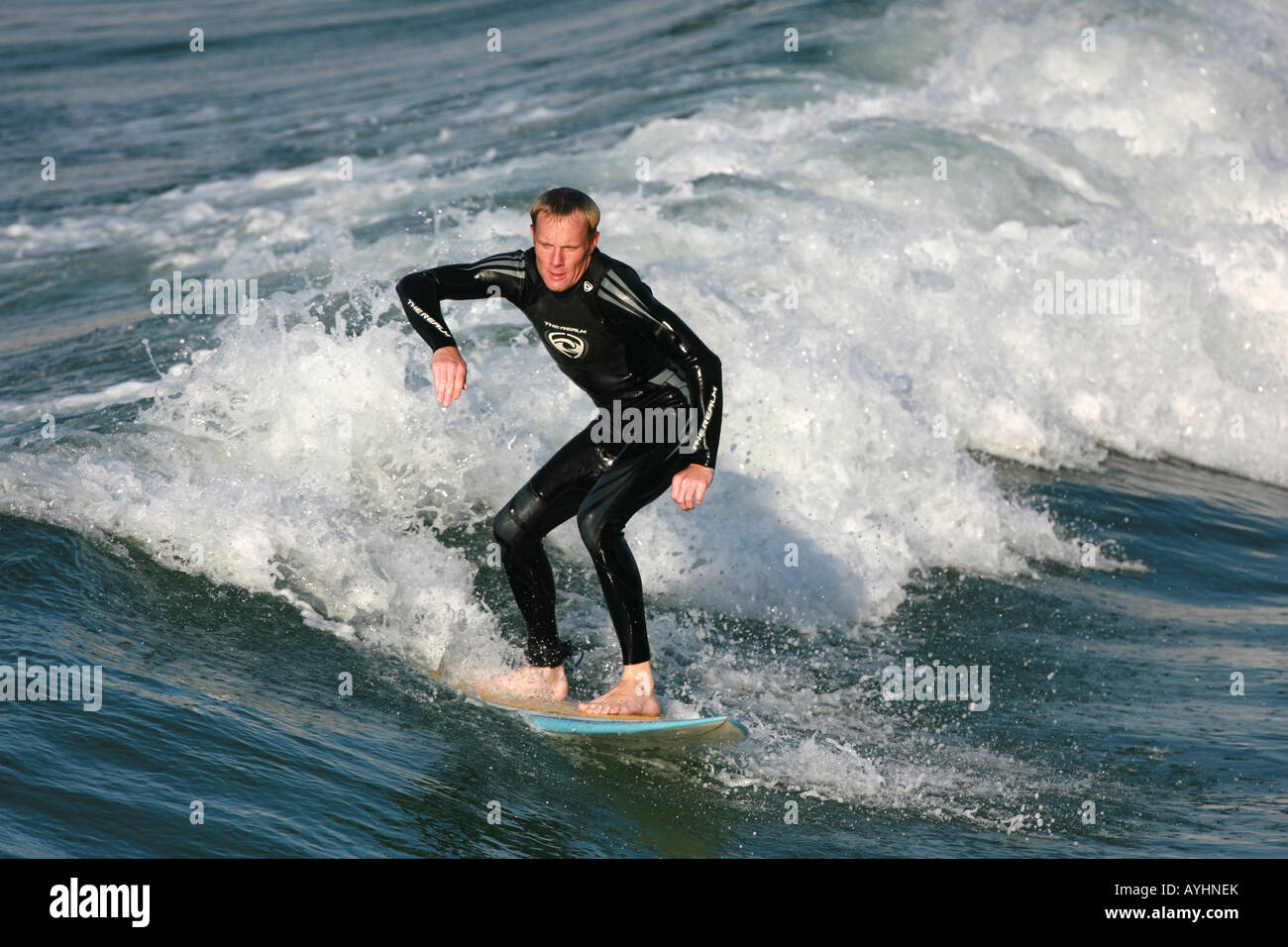 A Surfer riding a wave Stock Photo - Alamy
