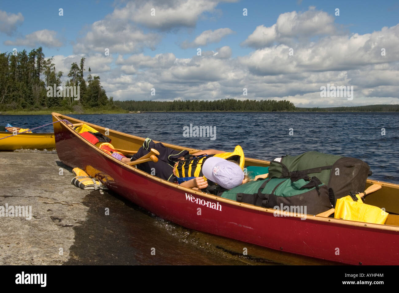 Loaded canoe on shoreline Stock Photo - Alamy