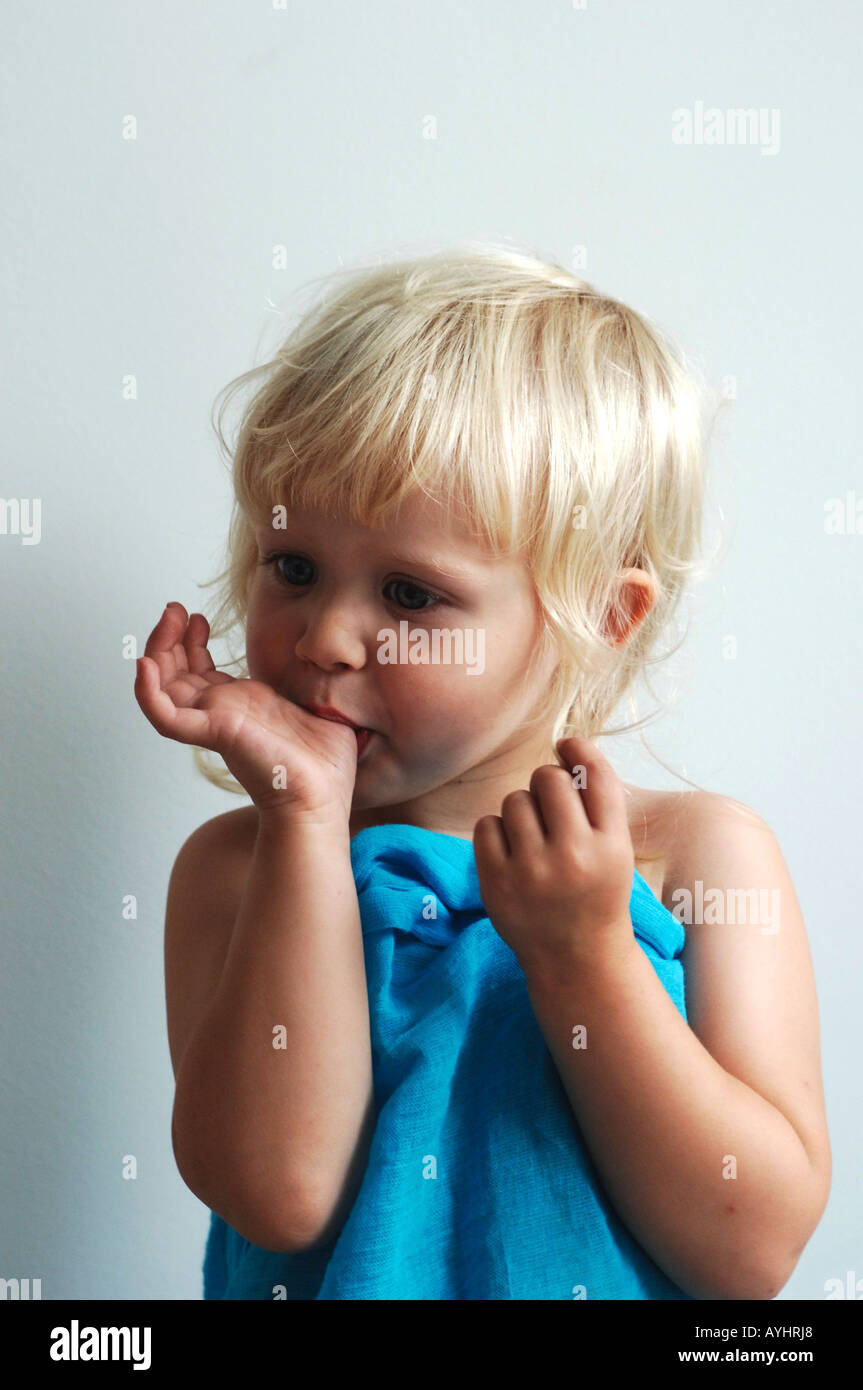 Portrait of a two year old girl toddler sucking her thumb Stock Photo ...