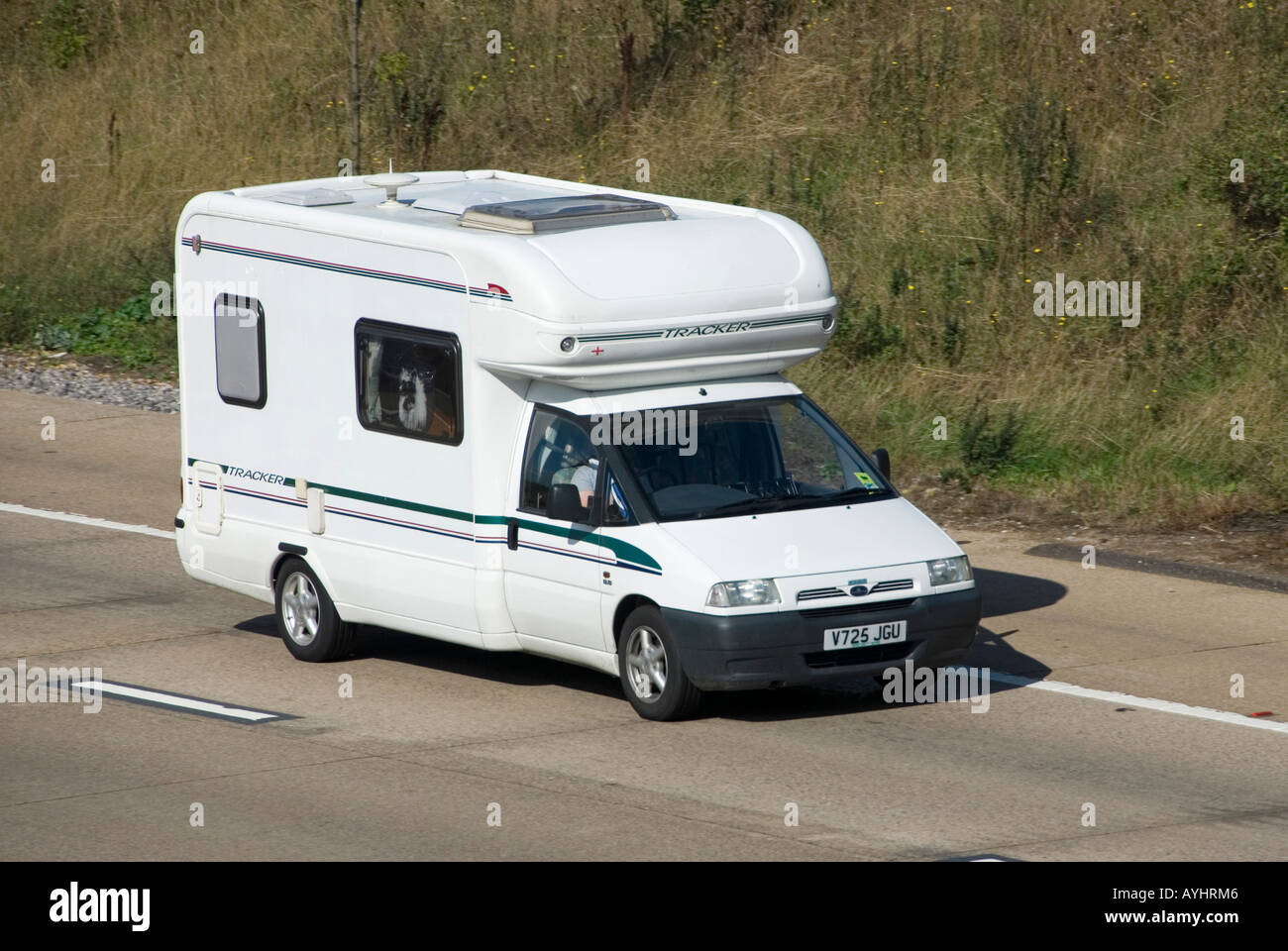 View from above of roof side & front of white RV Tracker camper van ...