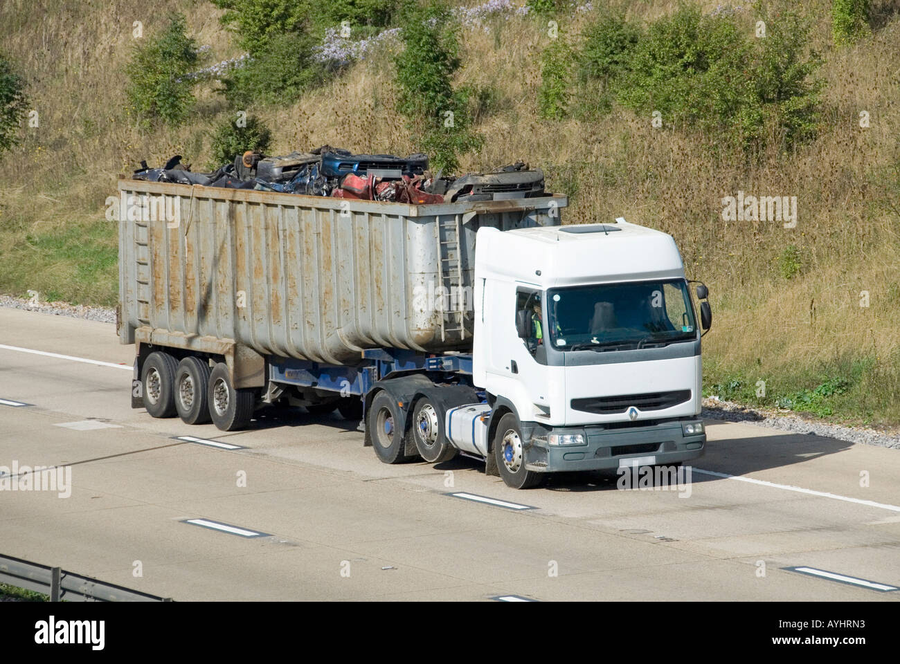 M25 motorway unmarked articulated lorry loaded with crushed broken up ...