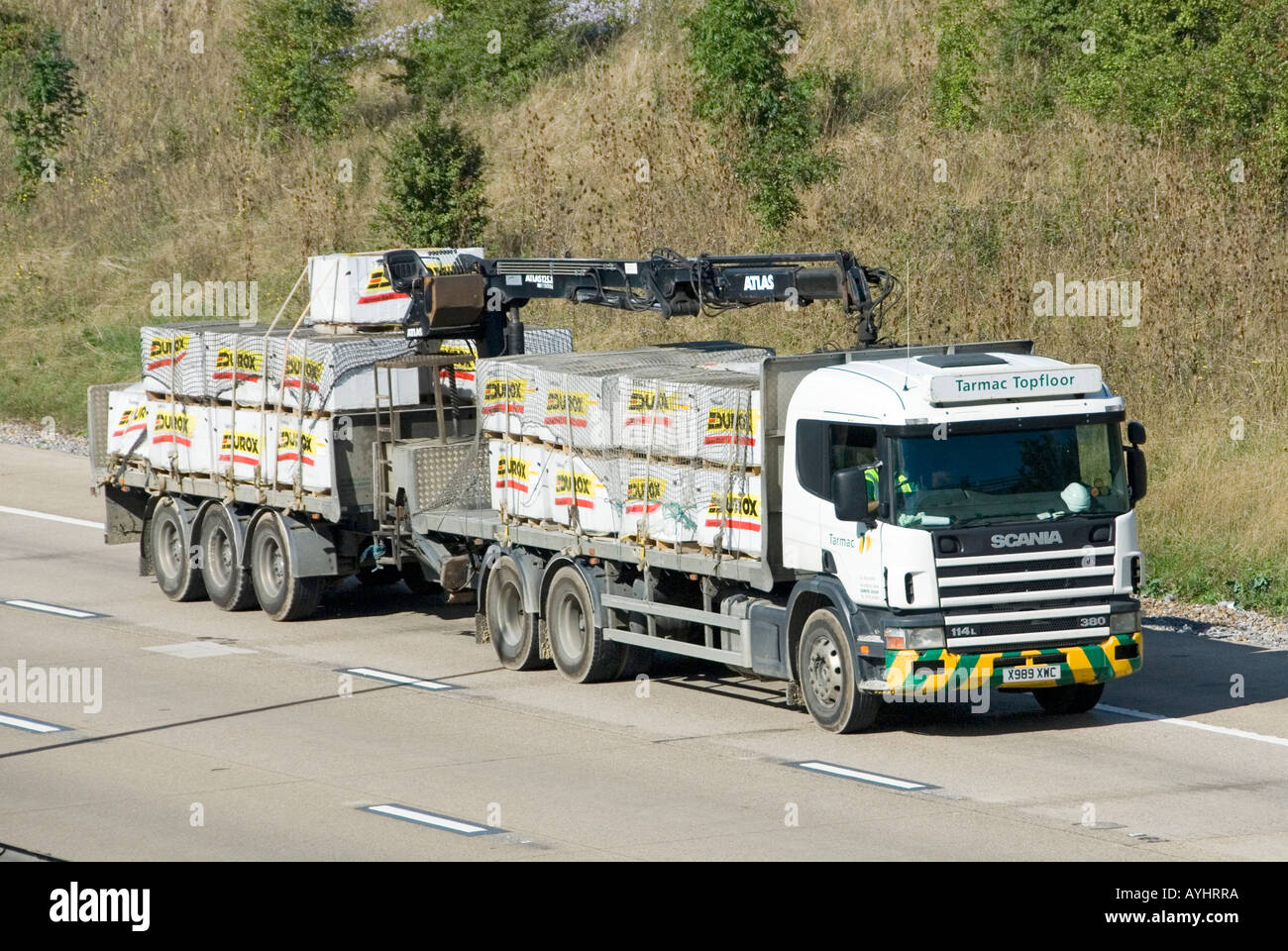 Truck & trailer loaded with net covered building blocks lorry fitted ...