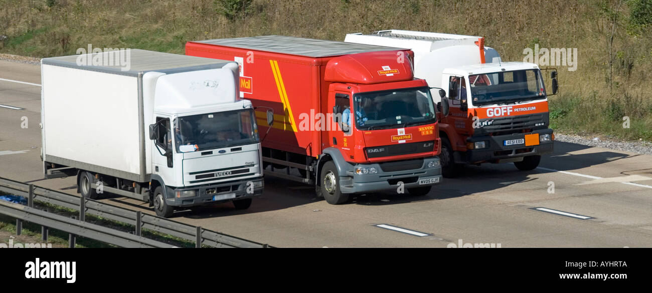 View from above of side & front of three rigid bodied lorry trucks ...