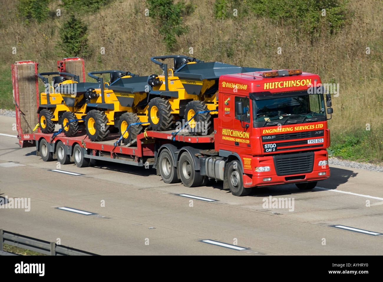 Low loader articulated lorry loaded with new Barford dumper trucks ...