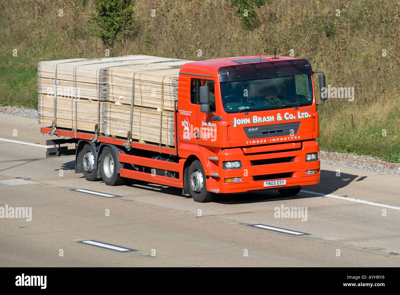Rigid base flat back lorry loaded with new timber scaffold boards Stock ...