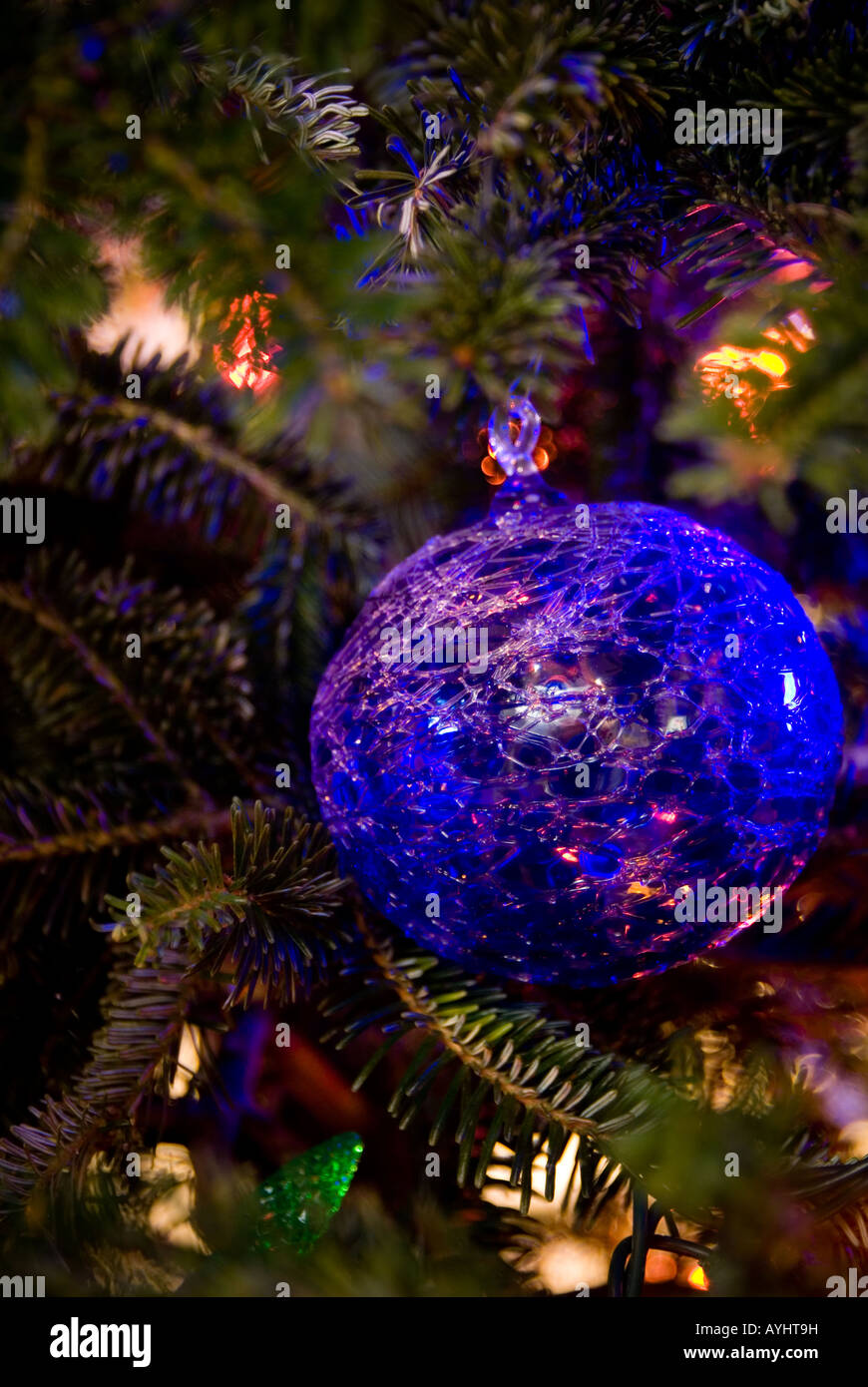 Blue glass Christmas ornament on tree Stock Photo - Alamy