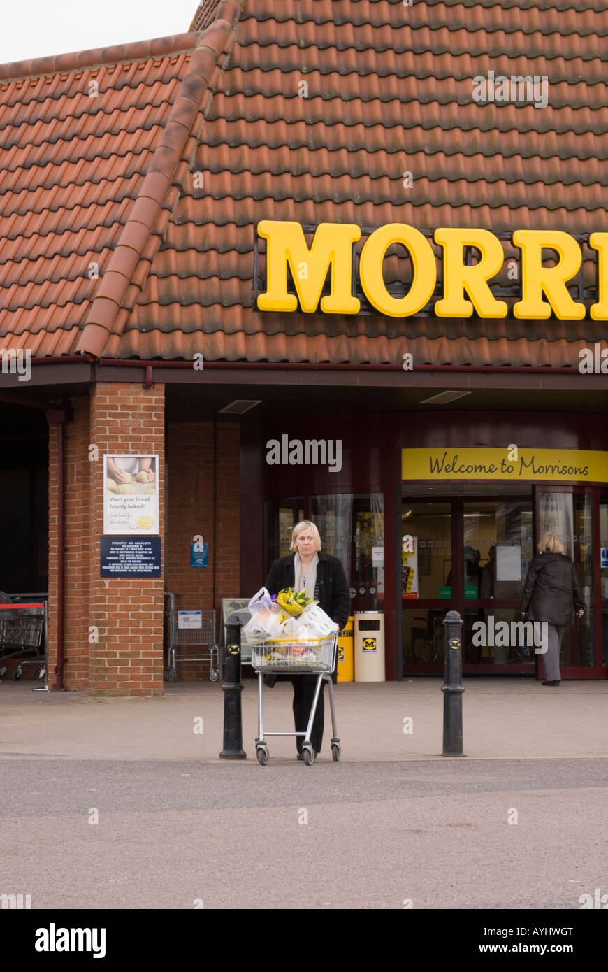 Woman Coming Out Of Morrisons Store At Beccles,Suffolk,Uk Stock Photo ...