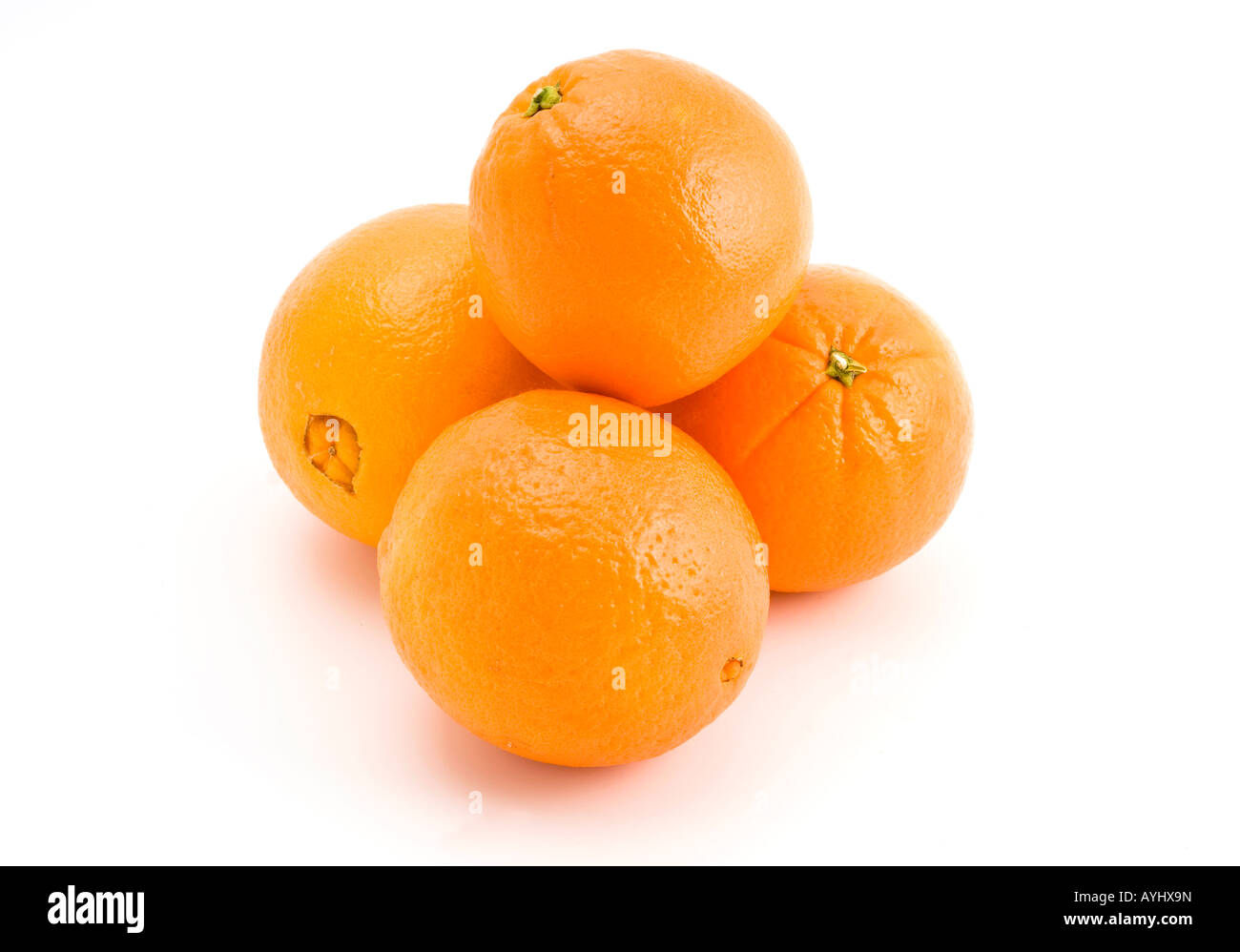 Four oranges on white background Stock Photo - Alamy