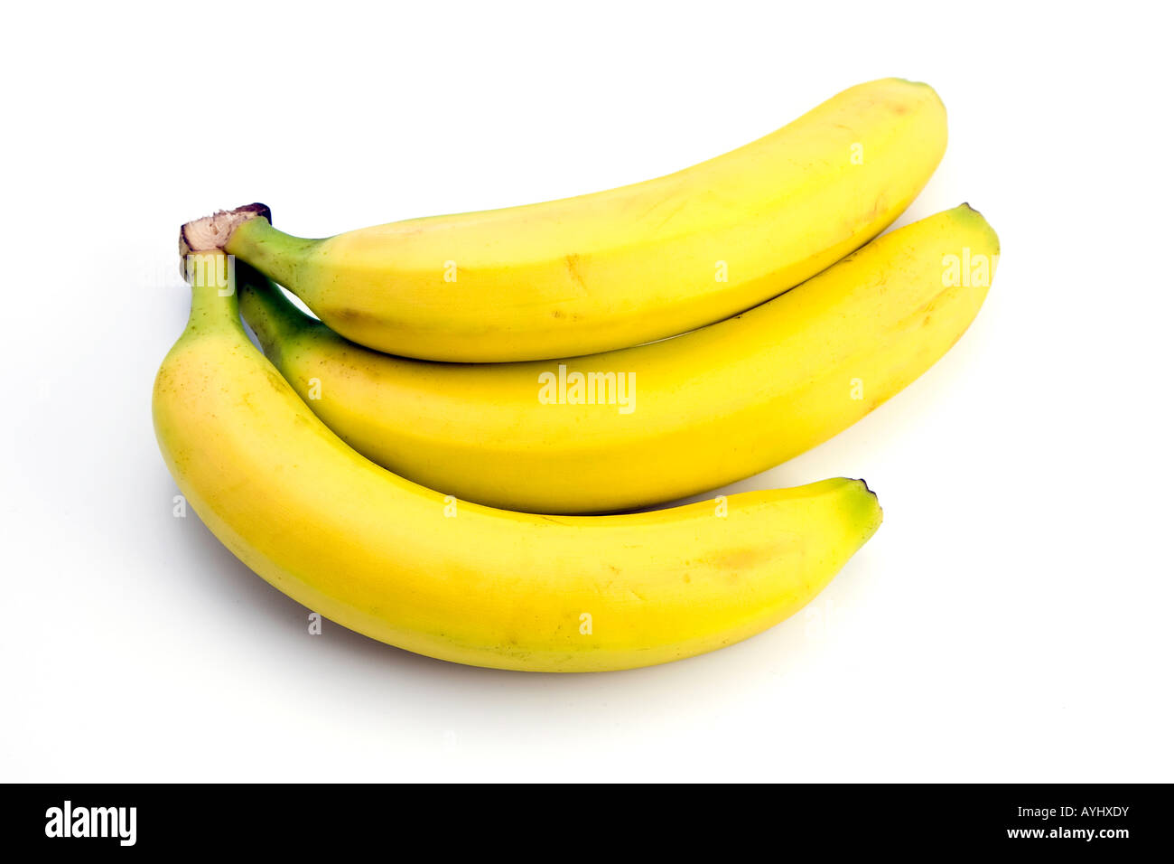 Three bananas on white background Stock Photo - Alamy