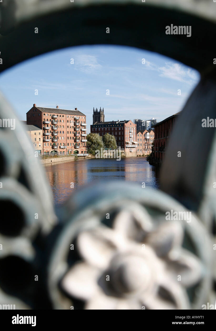 Leeds Waterfront viewed through the cast iron parapet of Leeds Bridge ...