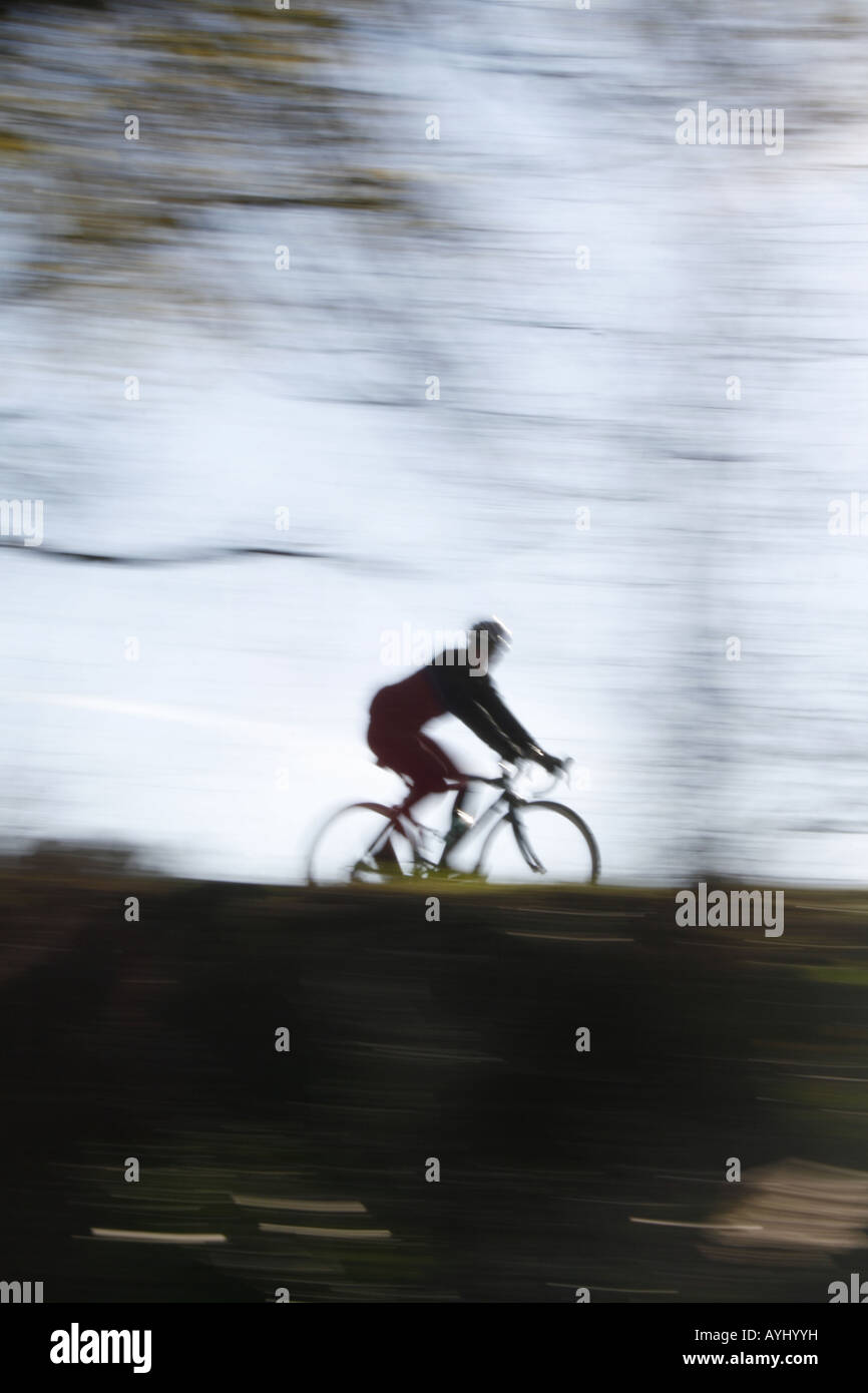 person riding fast bike in countryside Stock Photo - Alamy